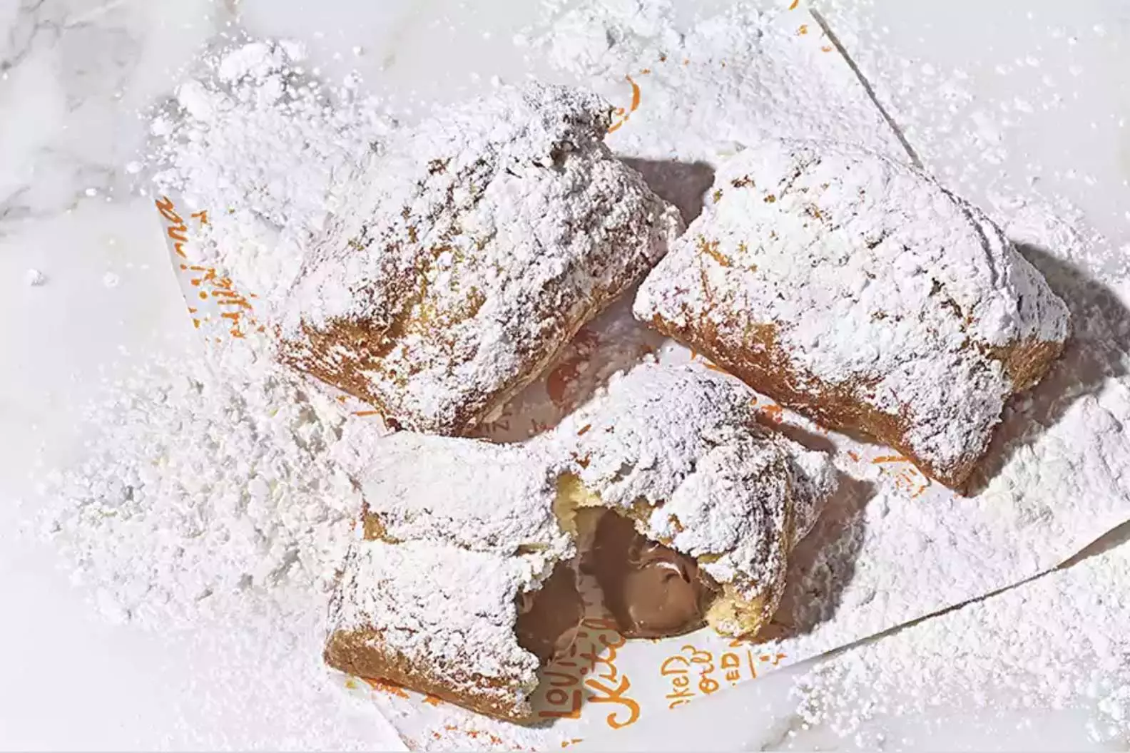 Popeyes Chocolate Beignets Akugunda Mamenyu M'malesitilanti Osankhidwa Tsopano 31349_1